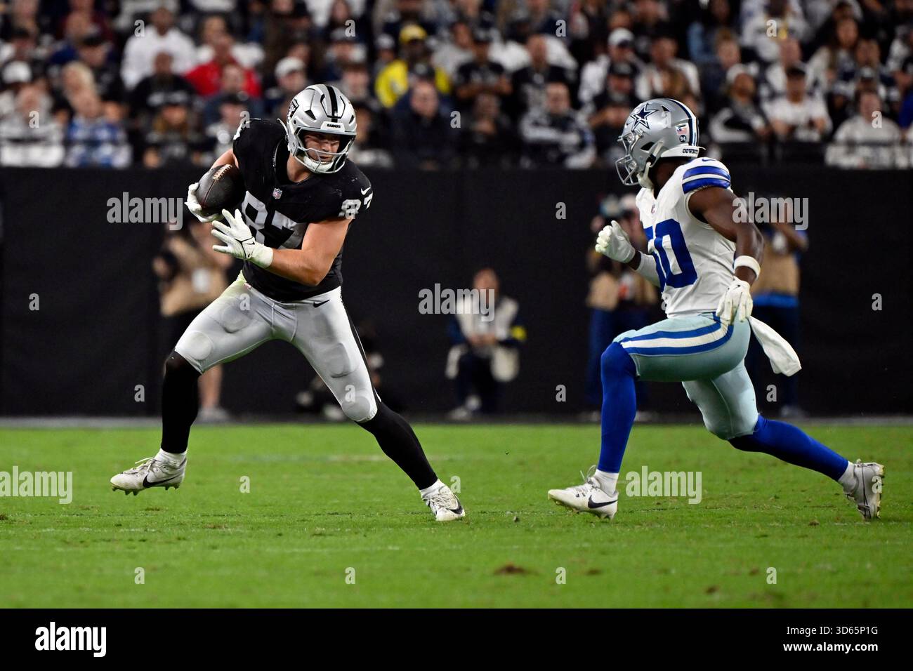 Las Vegas Raiders tight end Michael Mayer (87) runs with the ball ...