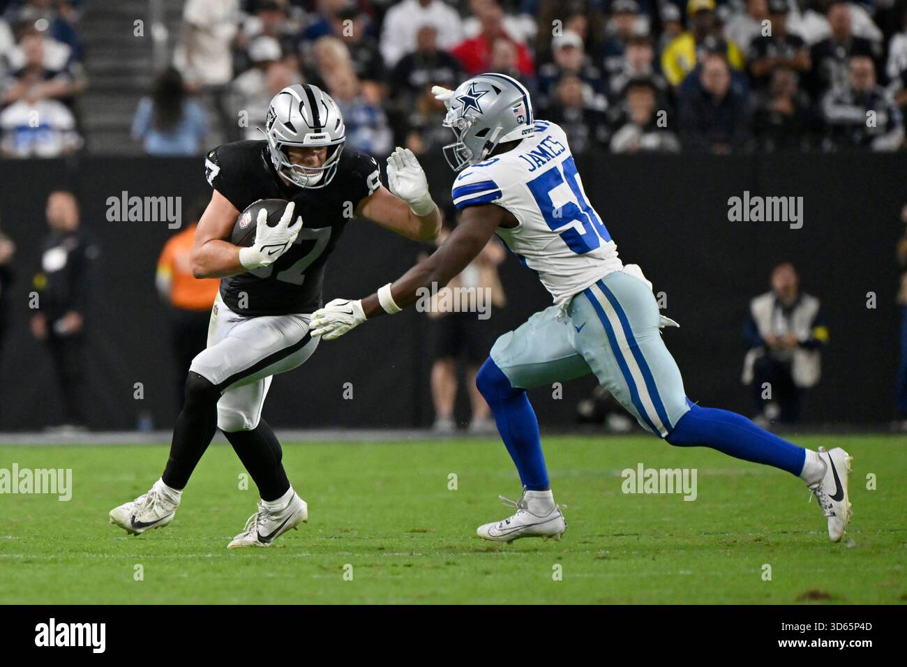 Las Vegas Raiders tight end Michael Mayer (87) runs with the ball ...