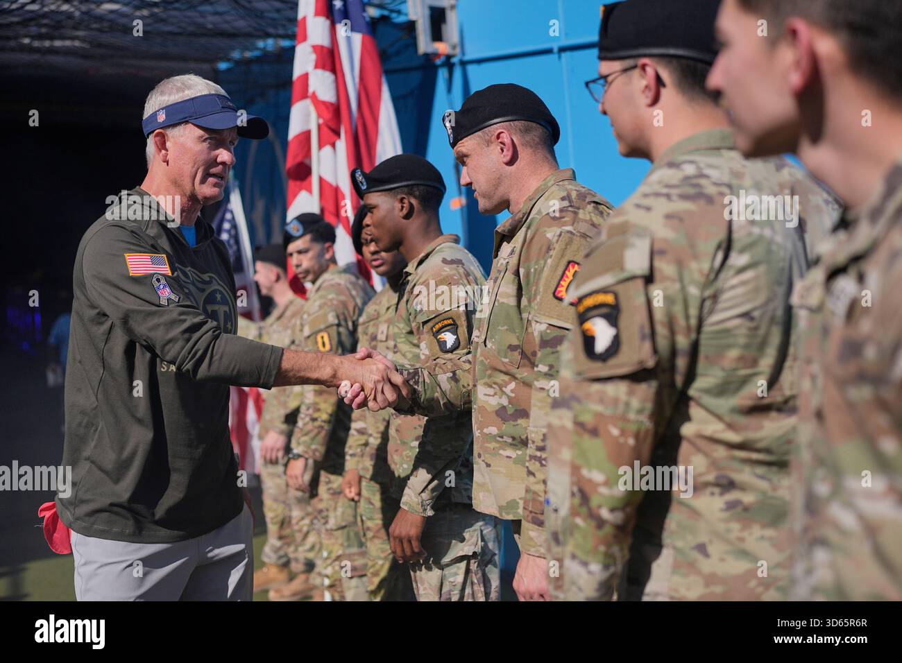 Tennessee Titans interim head coach Mike McCoy, left, greets members of ...