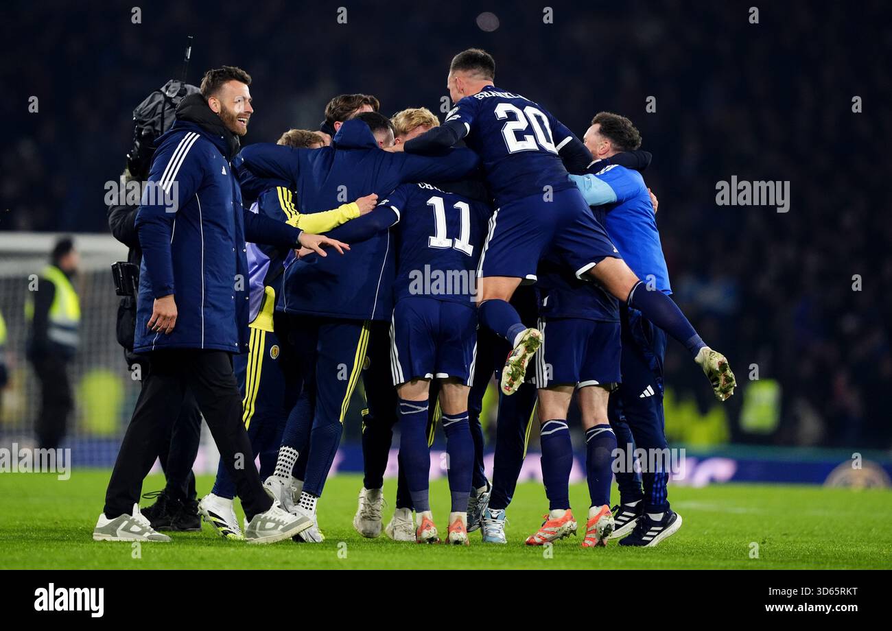 Scotland's Angus Gunn (left) celebrates with team mates following the ...