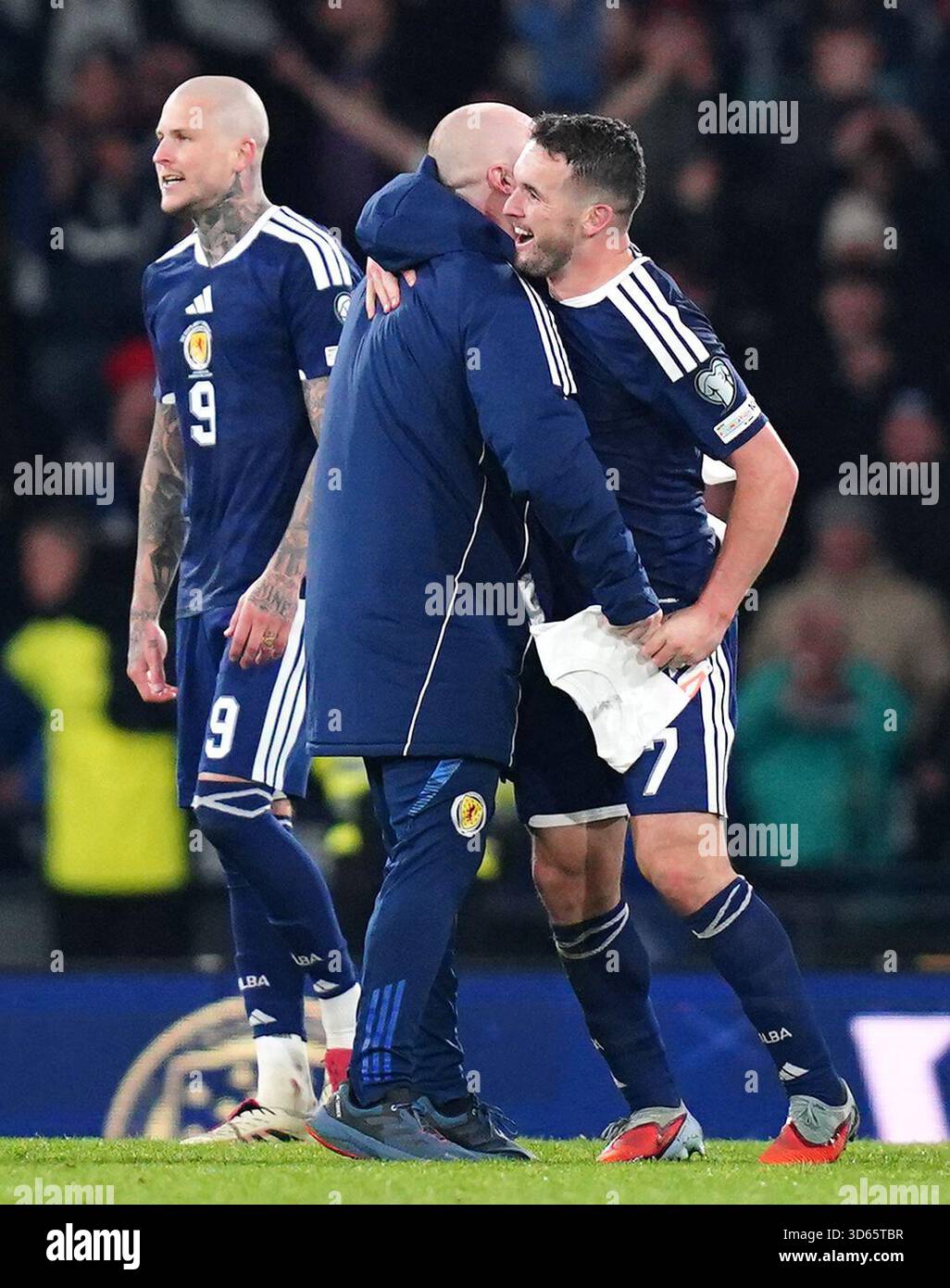 Scotland's John McGinn (right) celebrates with assistant manager Steven ...