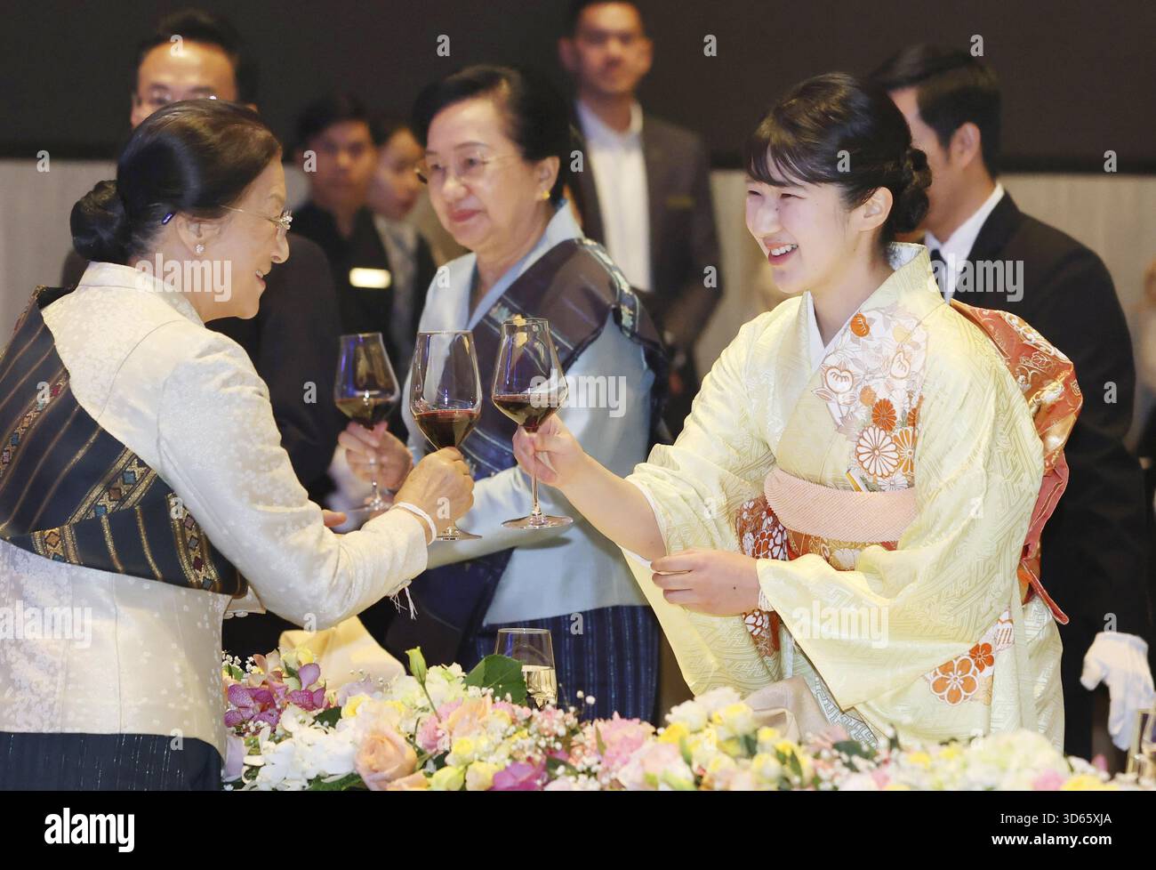 Japanese Princess Aiko (front, R) proposes a toast at a banquet hosted by Laotian Vice President ...