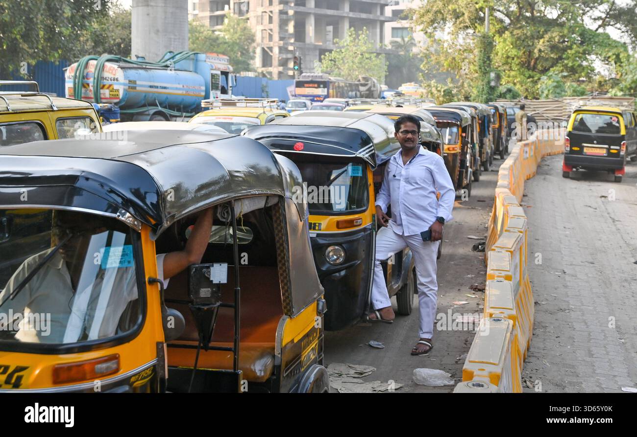 MUMBAI, INDIA - NOVEMBER 18: Long line of autorickshaws wait outside ...