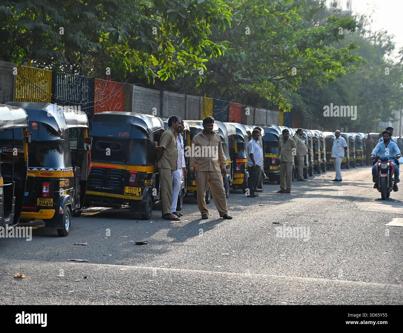 MUMBAI, INDIA - NOVEMBER 18: Long line of autorickshaws wait outside ...