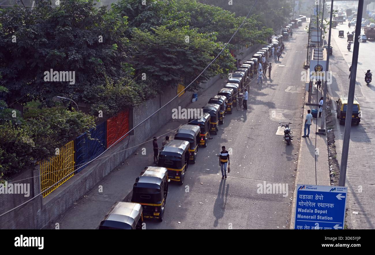 MUMBAI, INDIA - NOVEMBER 18: Long line of autorickshaws wait outside ...