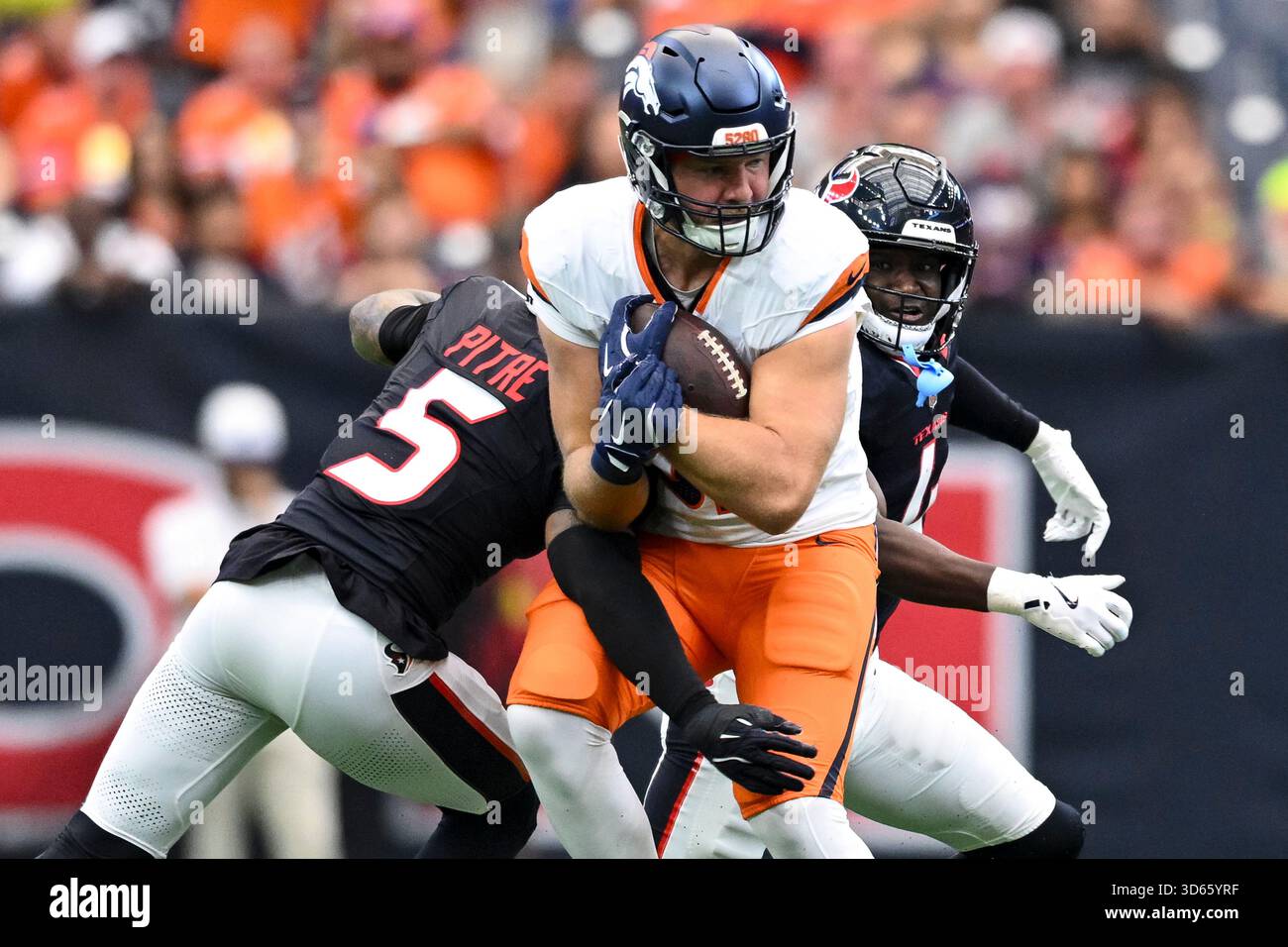 Denver Broncos wide receiver Michael Bandy (83) is tackled by Houston ...