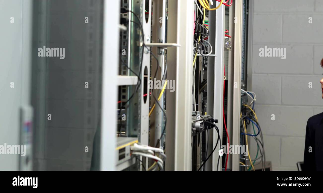 Showing rack assembly with patch panels, dense cables in server room ...
