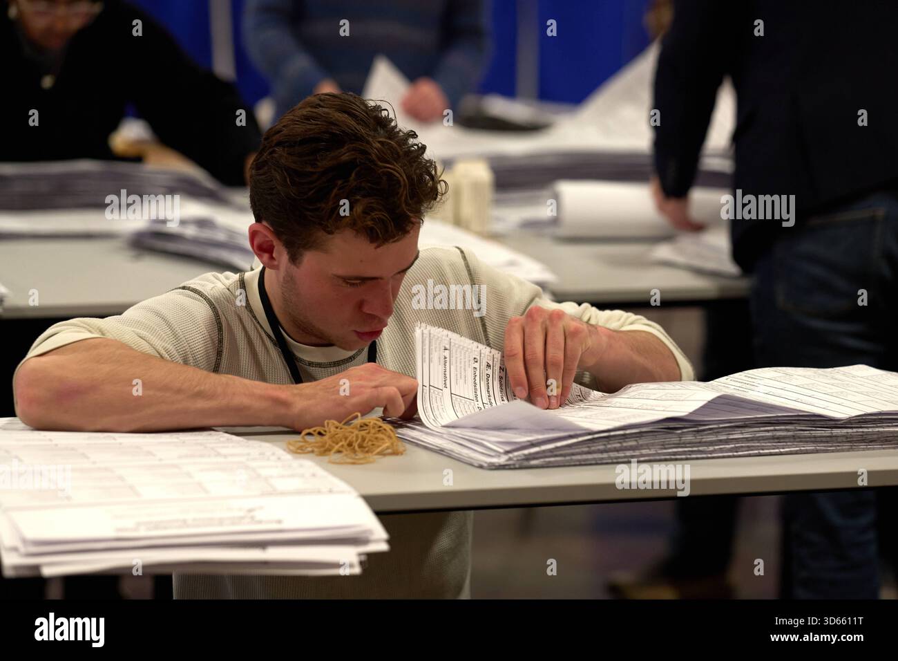 Officials counts paper voting ballots by hand during municipal and ...