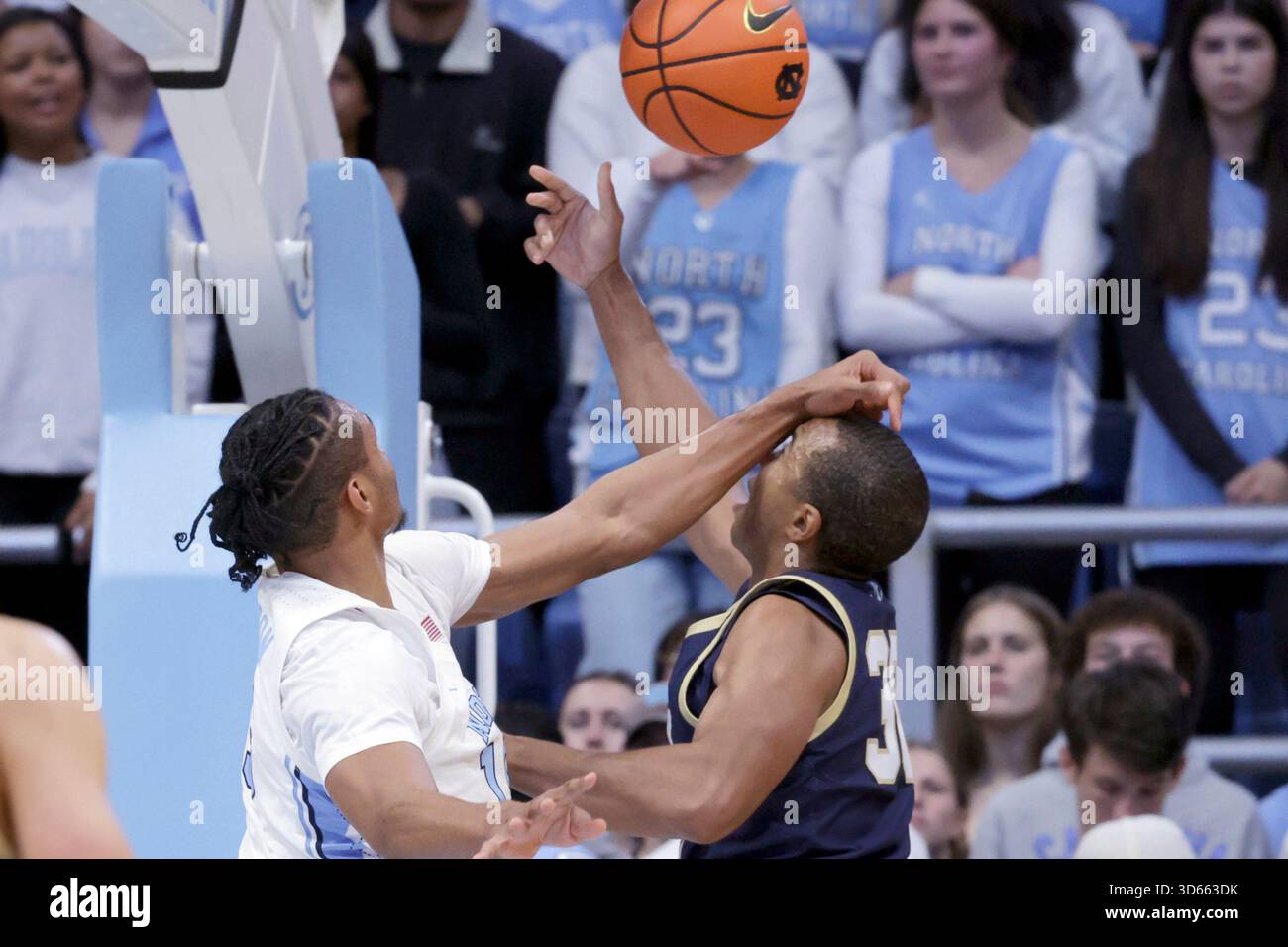 North Carolina forward Jarin Stevenson, left, defends against Navy ...