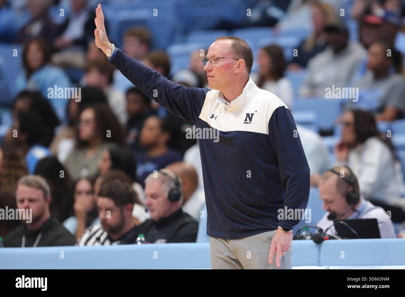 CHAPEL HILL, NC - NOVEMBER 18: Jon Perry of the Navy Midshipmen signals ...