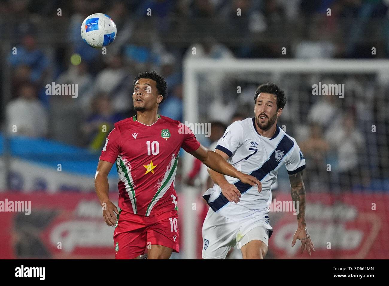 Suriname's Denzel Jubitana, left, and Guatemala's Aaron Herrera vie for ...