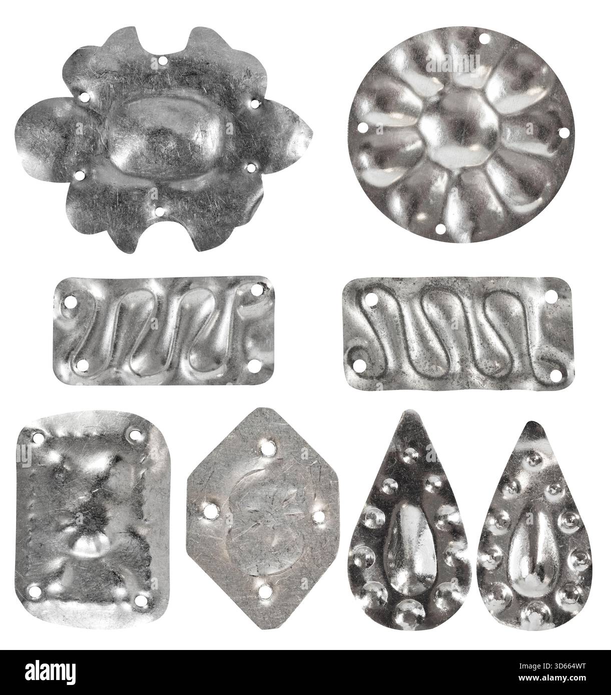 Isolated photo of worn, medieval and rusty engraved metal armor inlays ...