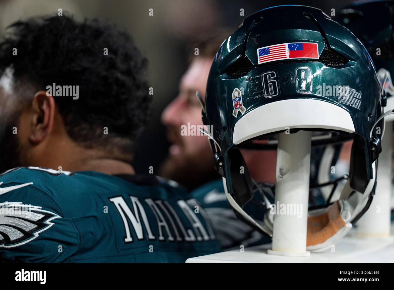 Philadelphia Eagles tackle Jordan Mailata helmet hits on the bench post ...