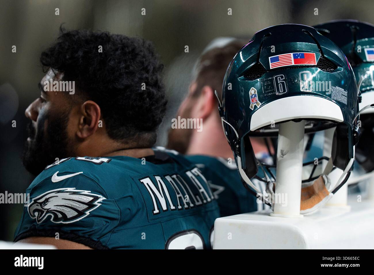 Philadelphia Eagles tackle Jordan Mailata helmet hits on the bench post ...