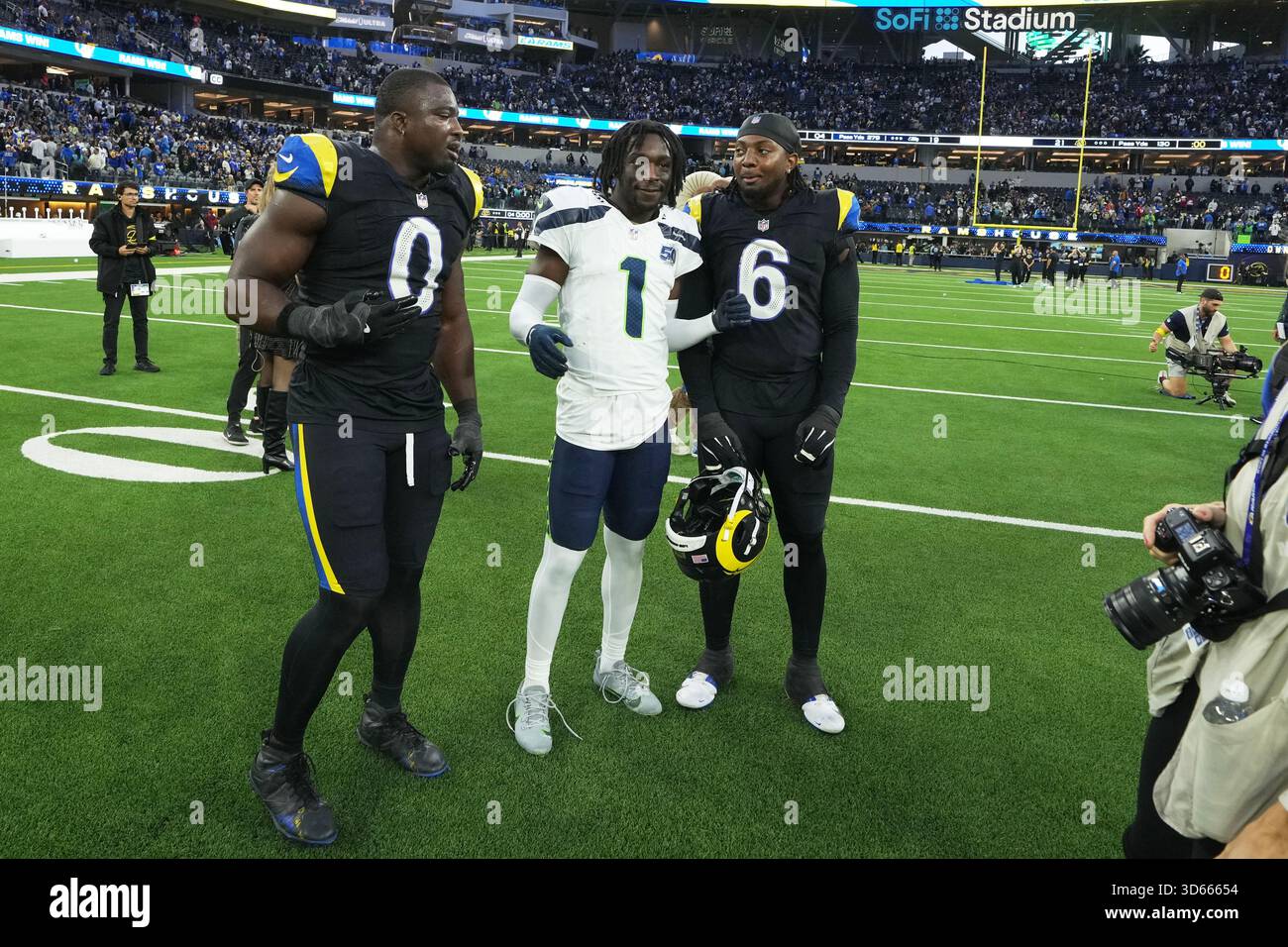 Los Angeles Rams linebacker Byron Young, left, poses with Seattle ...