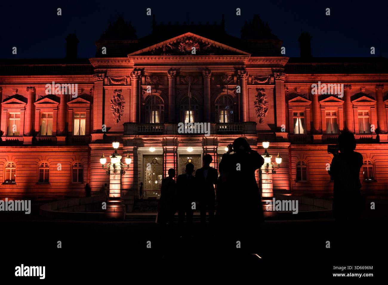 State Guest House in Tokyo is illuminated in orange as part of a ...