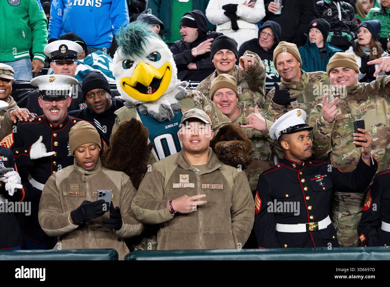 Philadelphia Eagles mascot Swoop, center, poses for a photo with ...