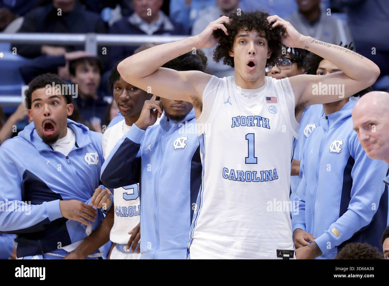 North Carolina forward Zayden High (1) and others on the bench react to ...