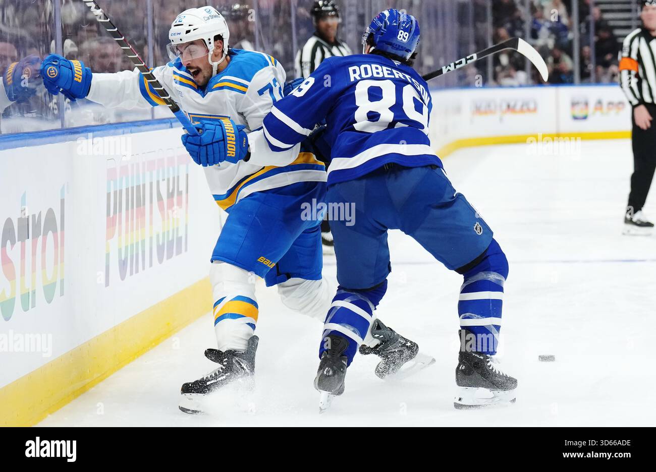 Toronto Maple Leafs' Nicholas Robertson (89) checks St. Louis Blues ...