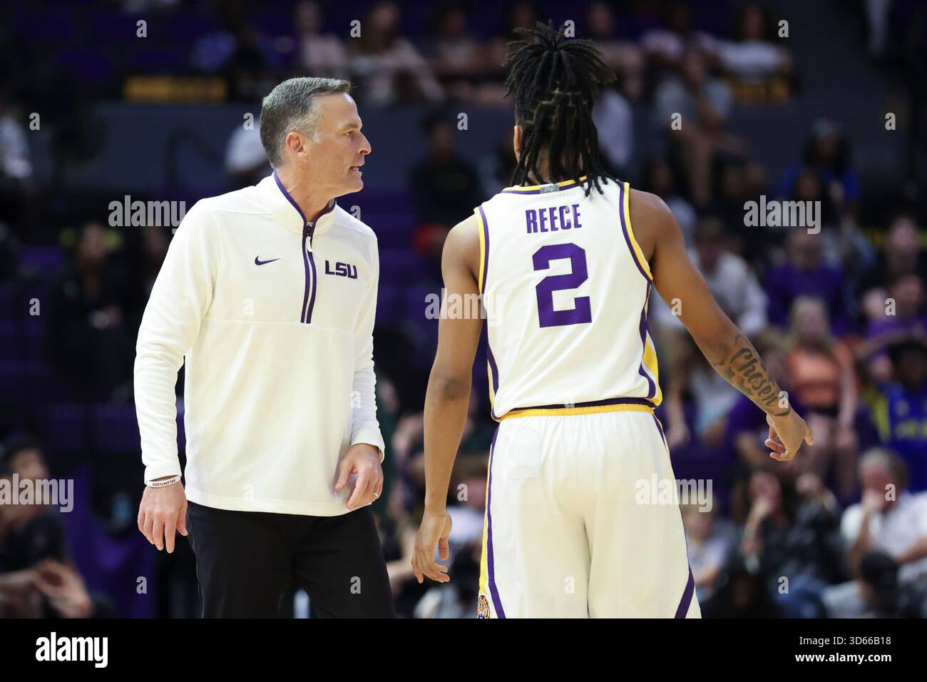 LSU Tigers head coach Matt McMahon talks to guard Jalen Reece (2 ...