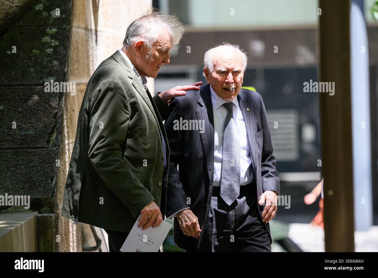 Former Australian Prime Minister John Howard (right) arrives for the ...