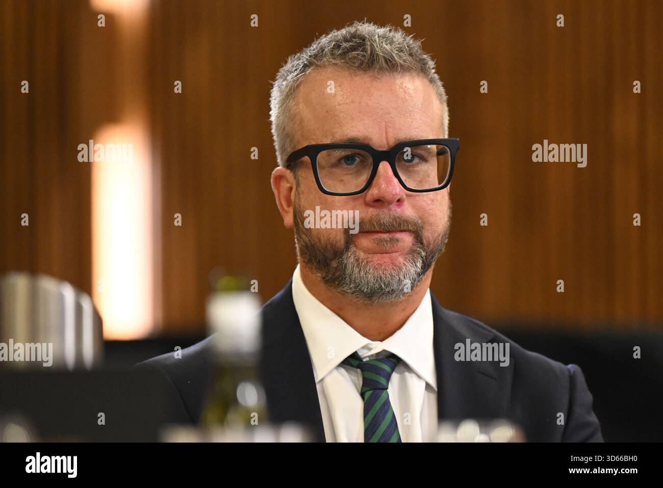 ABC News Director Justin Stevens listens to ABC managing director Hugh ...