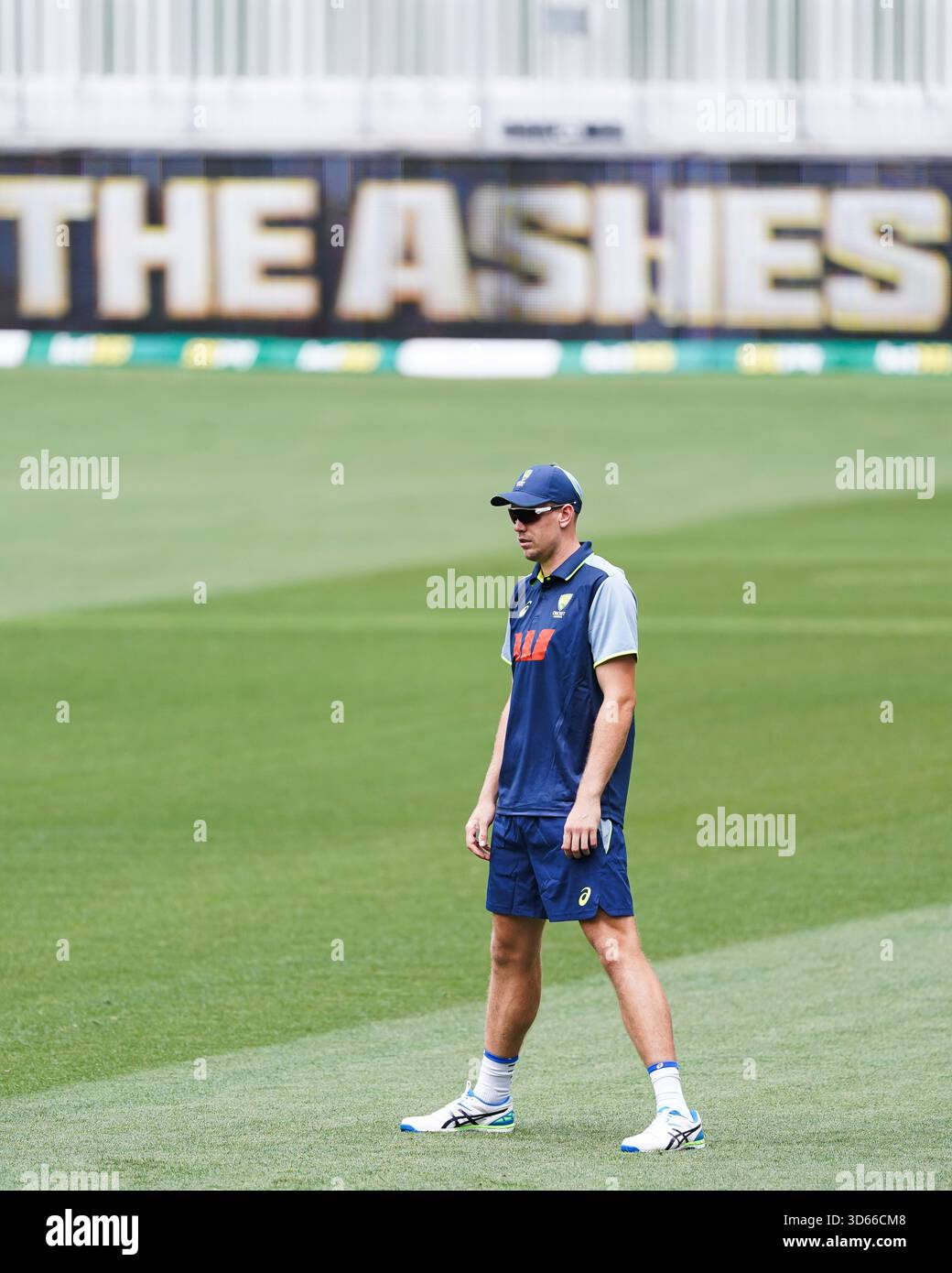 Australia's Brendan Doggett stands in the field during a nets session ...
