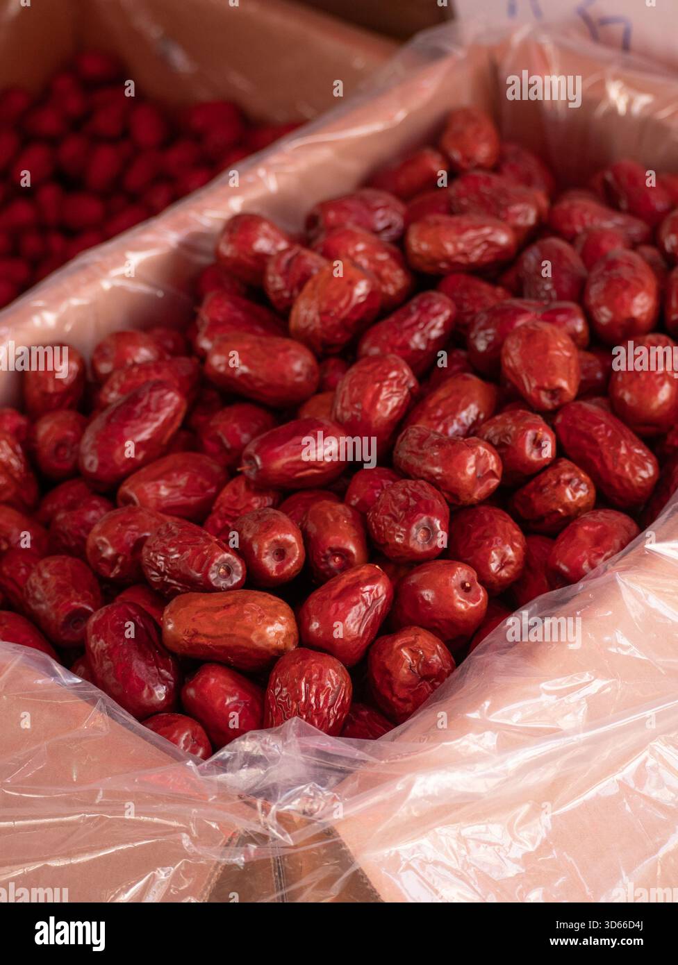 Fresh red dates in the box Stock Photo - Alamy