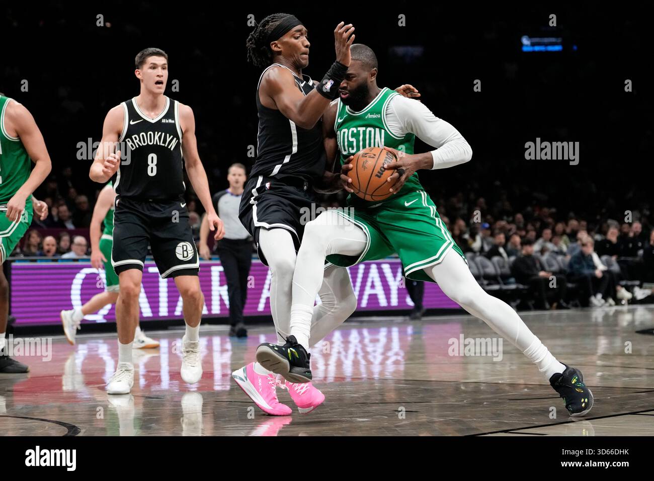 Boston Celtics guard Jaylen Brown (7) drives past Brooklyn Nets guard ...