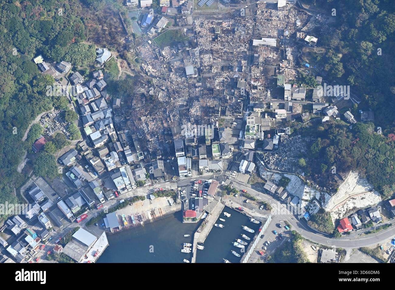 An aerial photograph shows the scene of a large-scale fire in Oita City, Japan, on November 19 ...