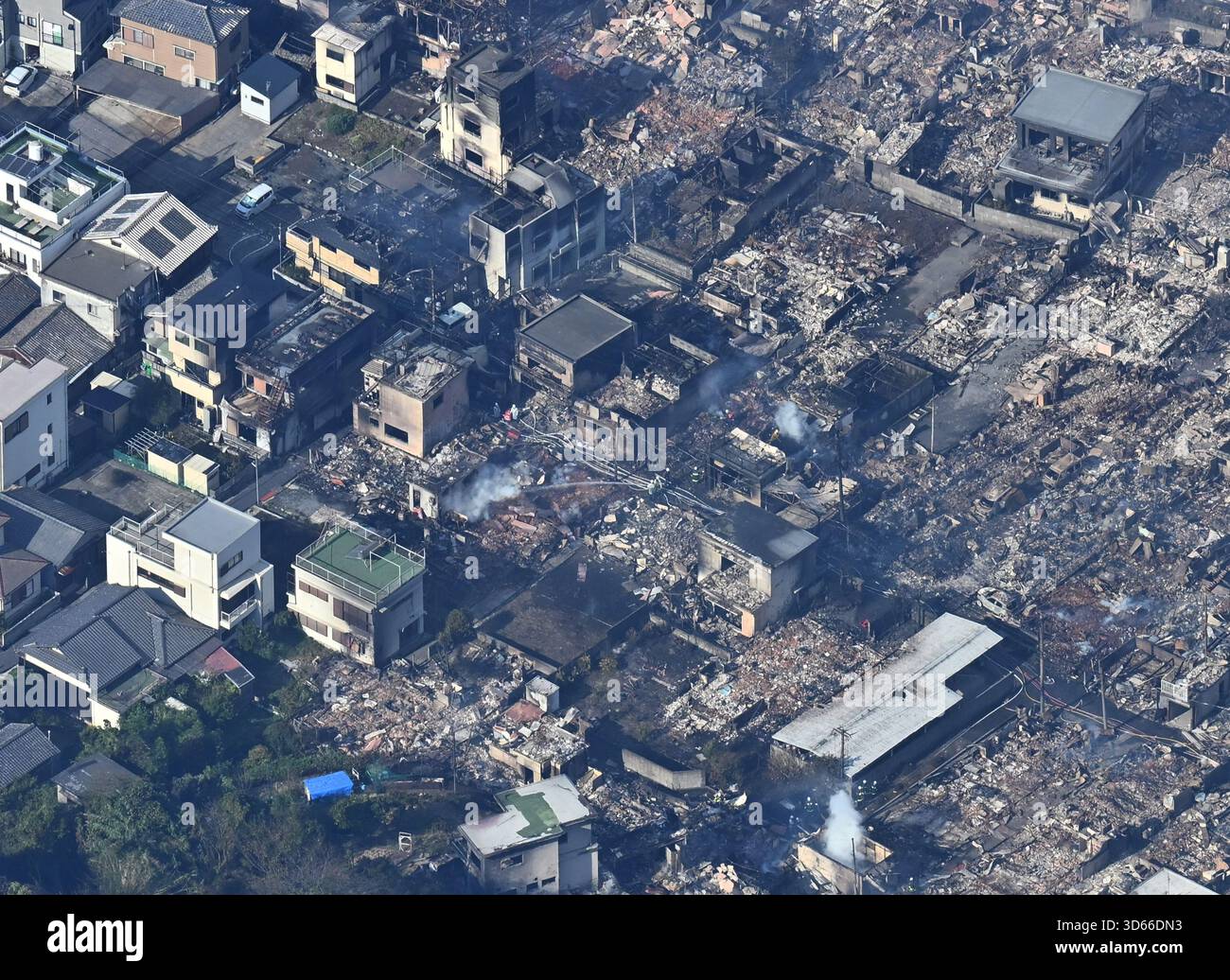 An aerial photograph shows the scene of a large-scale fire in Oita City, Japan, on November 19 ...