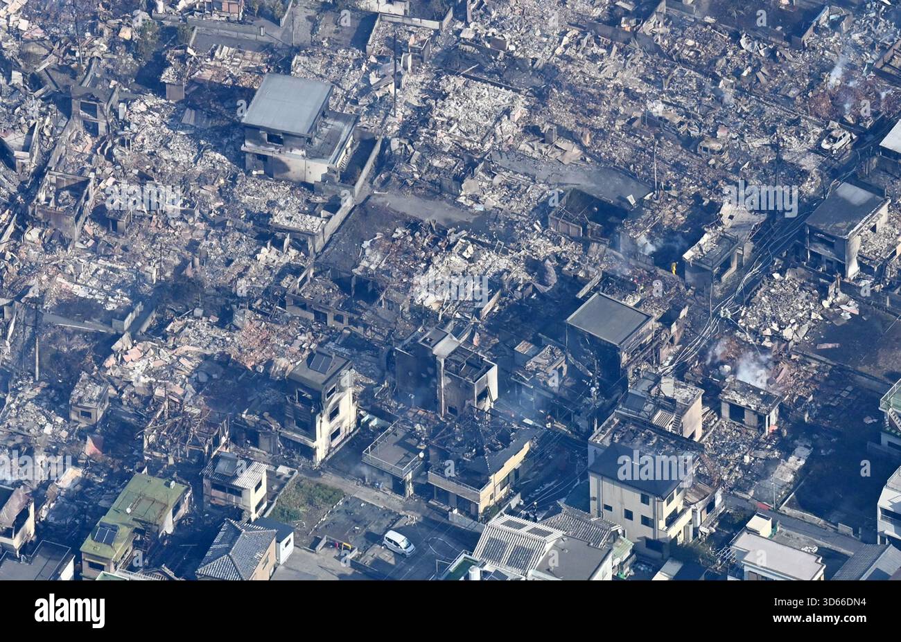 An aerial photograph shows the scene of a large-scale fire in Oita City, Japan, on November 19 ...