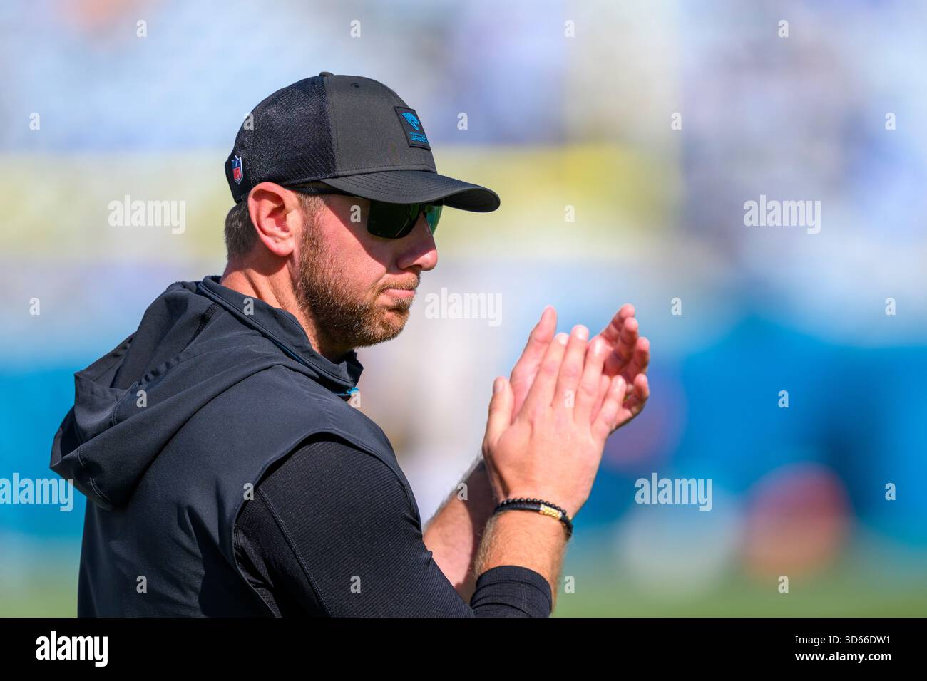 Jacksonville Jaguars head coach Liam Coen claps his hands on the field ...