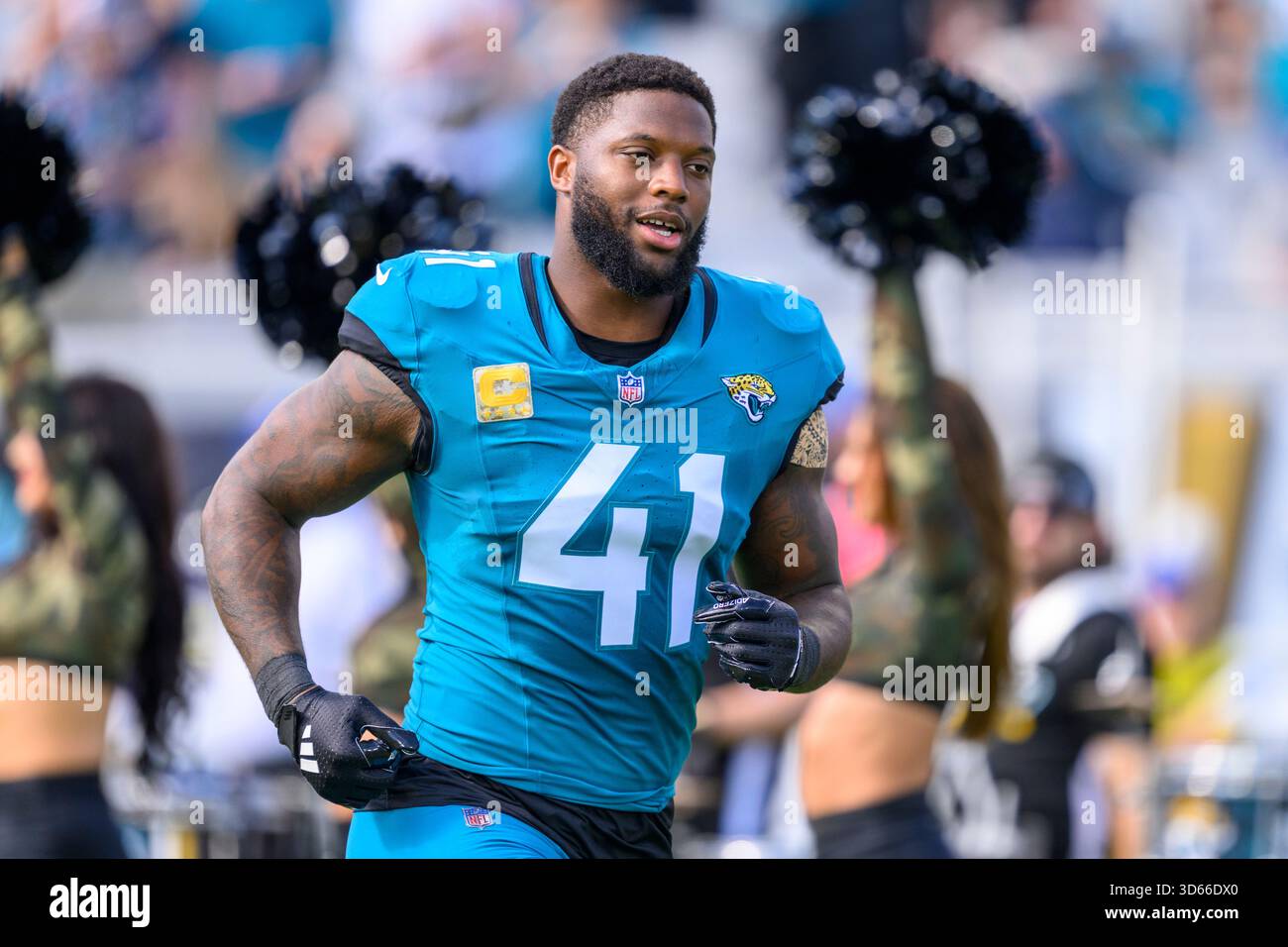 Jacksonville Jaguars defensive end Josh Hines-Allen (41) runs onto the ...