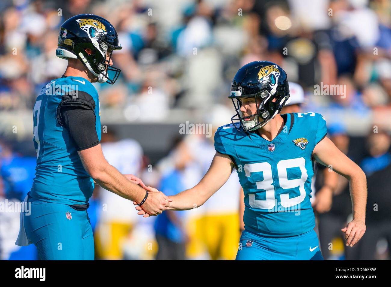 Jacksonville Jaguars punter Logan Cooke (9) and kicker Cam Little (39 ...