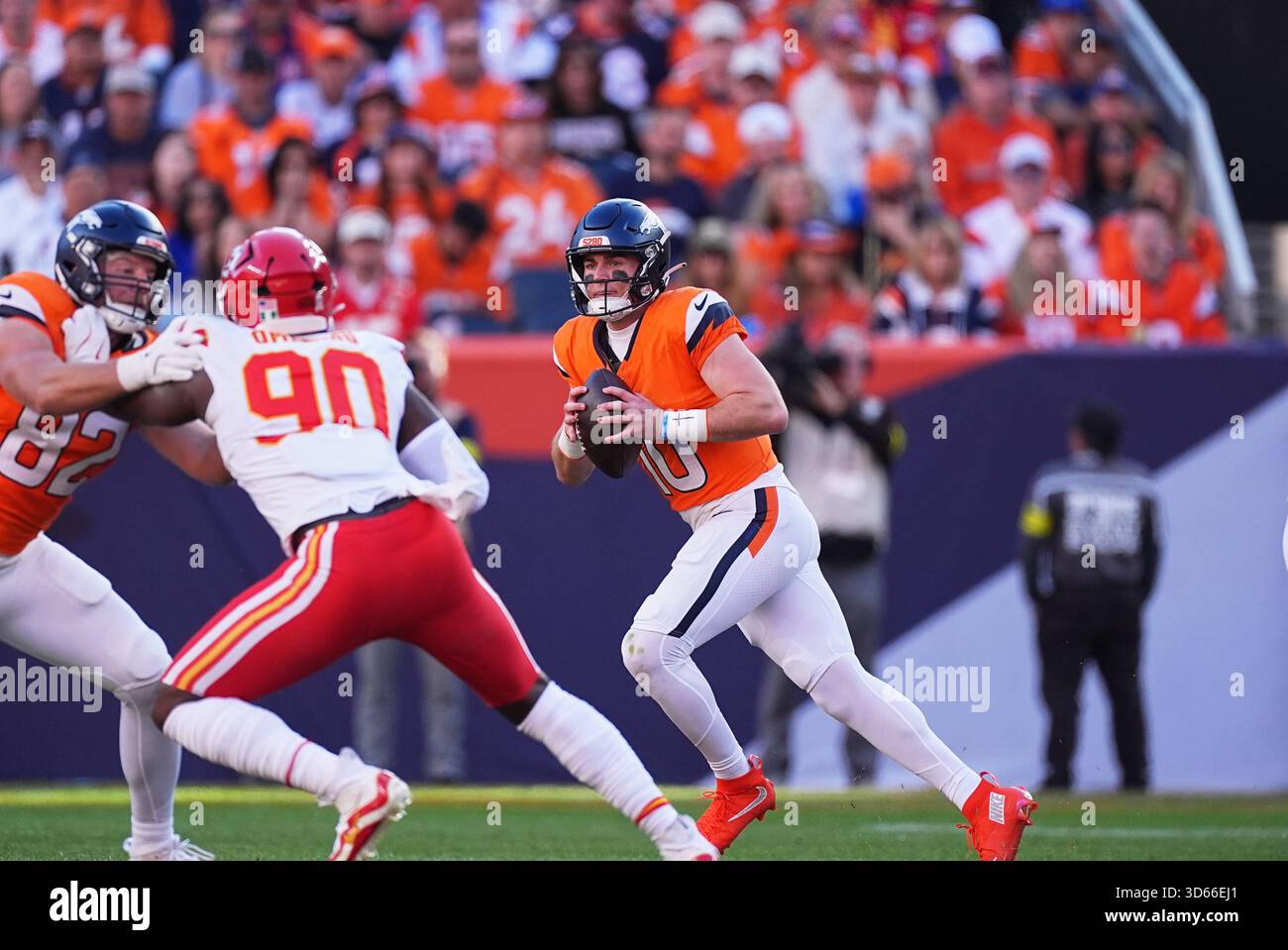 Denver Broncos quarterback Bo Nix (10) rolls out to pass in the first ...