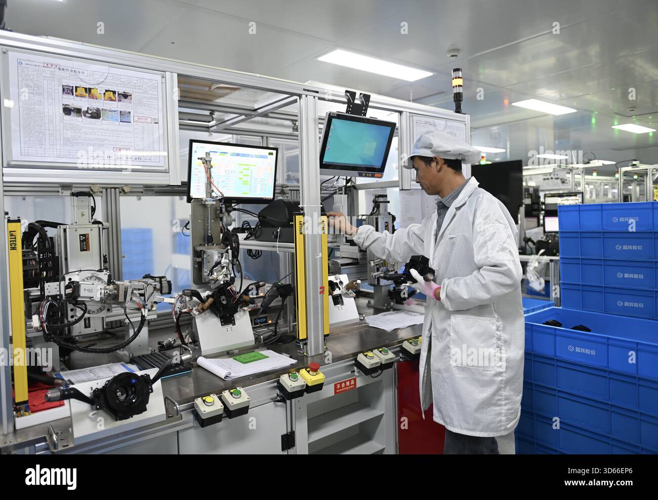 **CHINESE MAINLAND, HONG KONG, MACAU AND TAIWAN OUT** Workers assemble ...