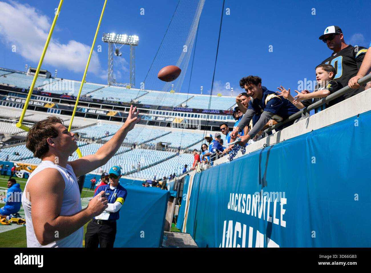 Los Angeles Chargers kicker Cameron Dicker (11) throws a football to a ...