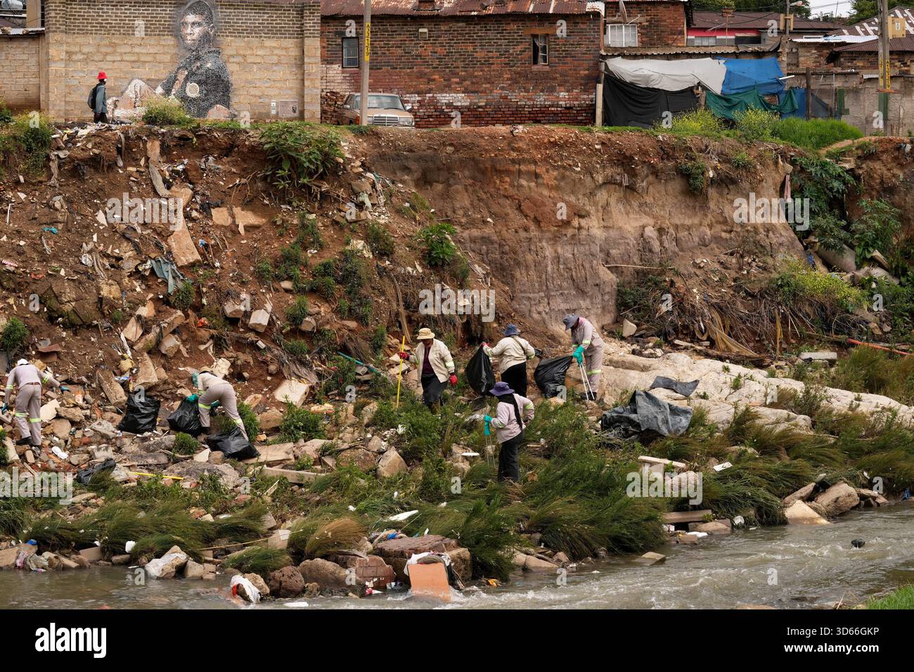 Volunteers clean up the Jukskei River in the Alexandra township in ...