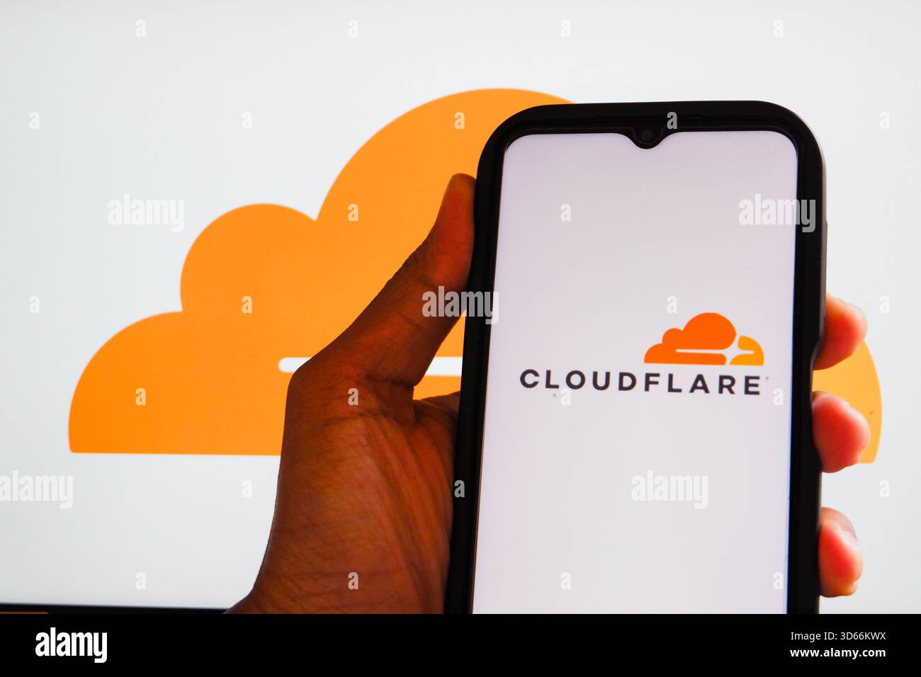 In this photo illustration, a Cloudflare logo is displayed on a ...