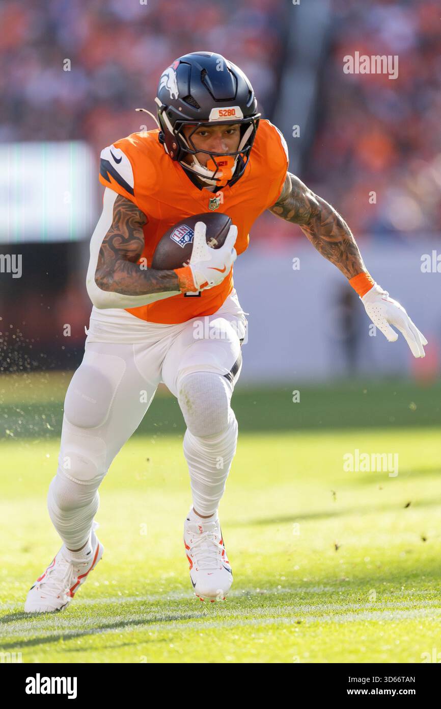 Denver Broncos tight end Evan Engram (1) catches a pass and runs ...