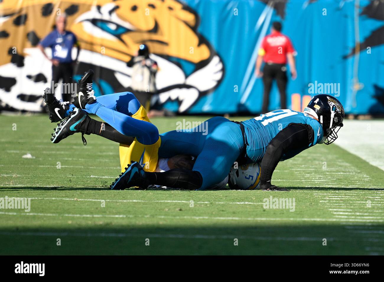 Los Angeles Chargers quarterback Trey Lance (5) is sacked by ...