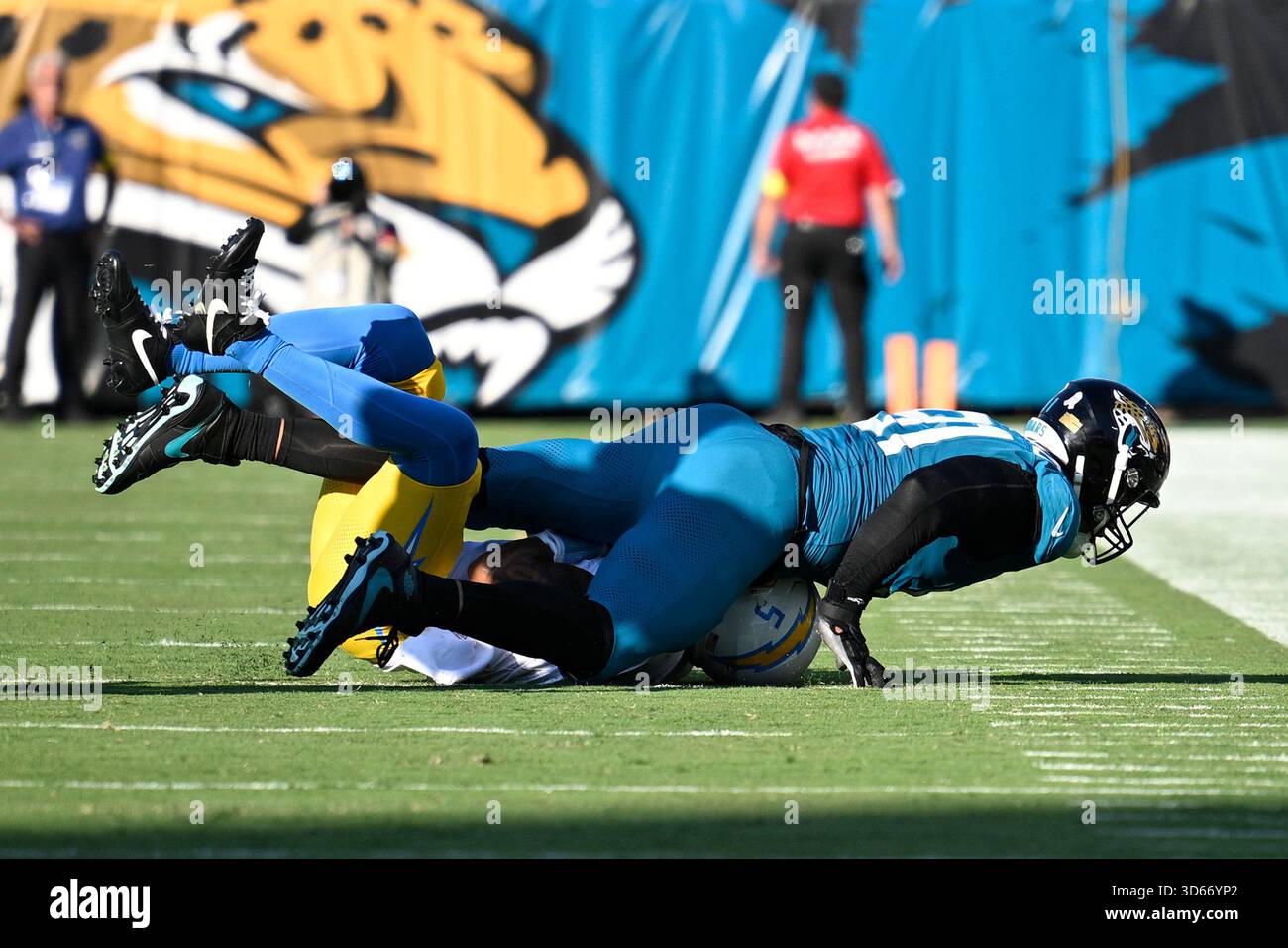 Los Angeles Chargers quarterback Trey Lance (5) is sacked by ...