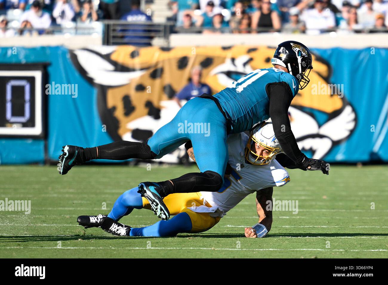 Los Angeles Chargers quarterback Trey Lance (5) is sacked by ...