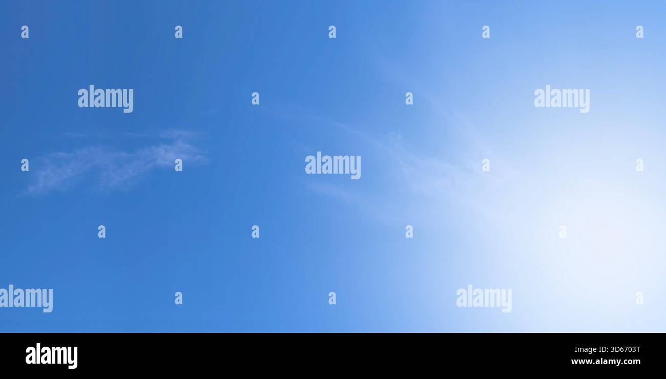 Clean soft pale blue sky with very faint almost imperceptible wisps ...