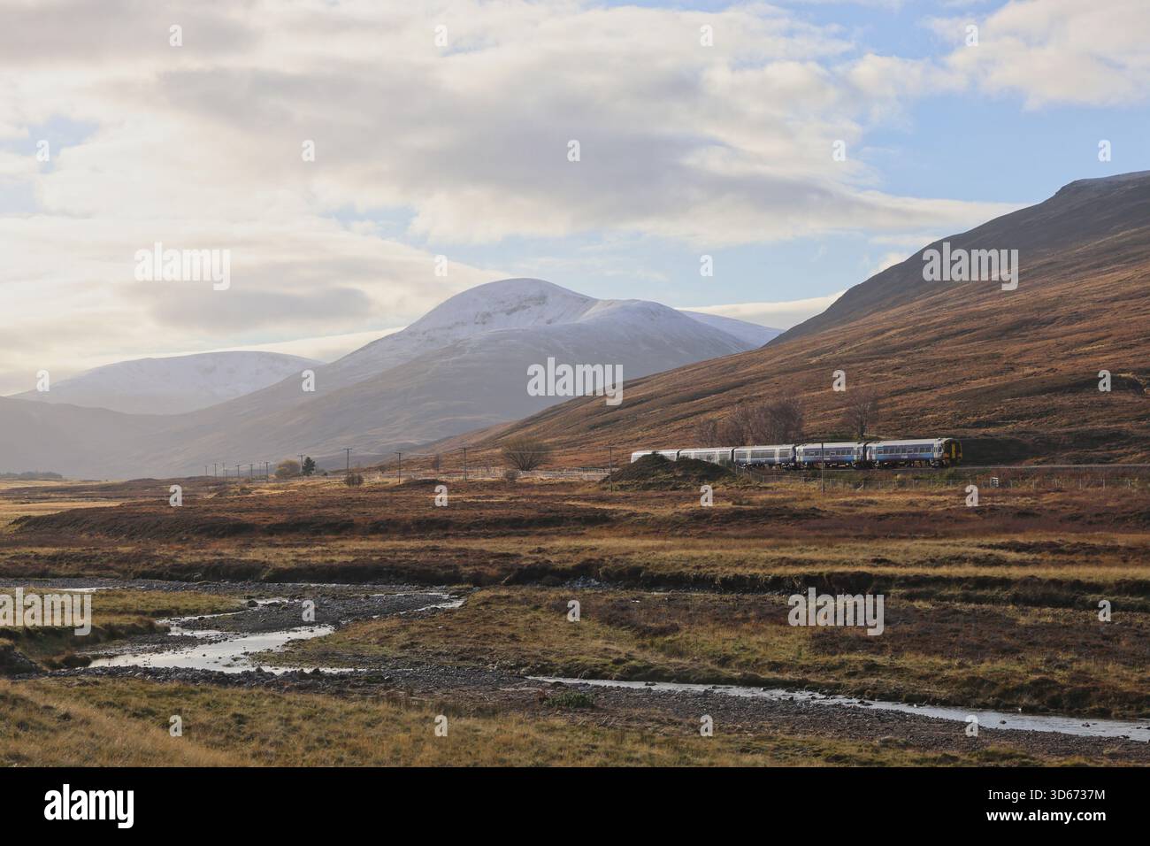 Scotrail train in Scottish Highlands near Dalwhinnie with River Truim ...
