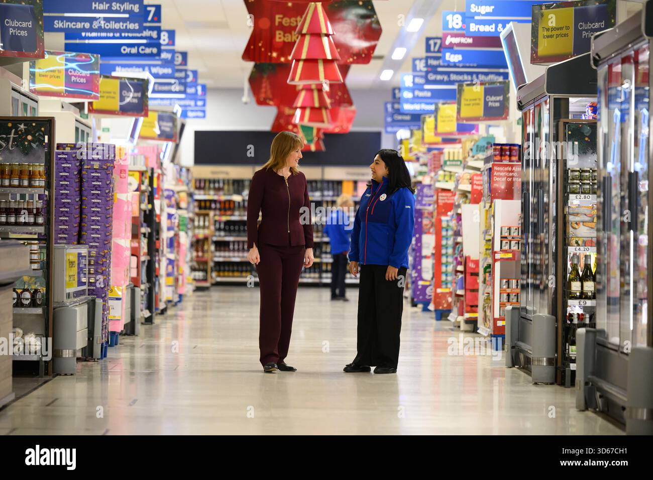 British Chancellor of the Exchequer Rachel Reeves, left, speaks with ...