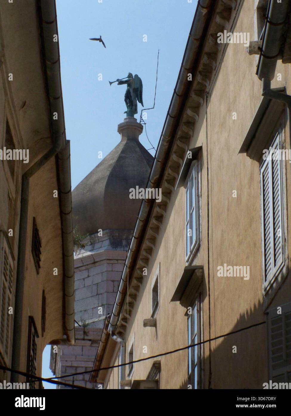 Tower of Saint Quirinus cathedral with the dome and the angel sculpture ...