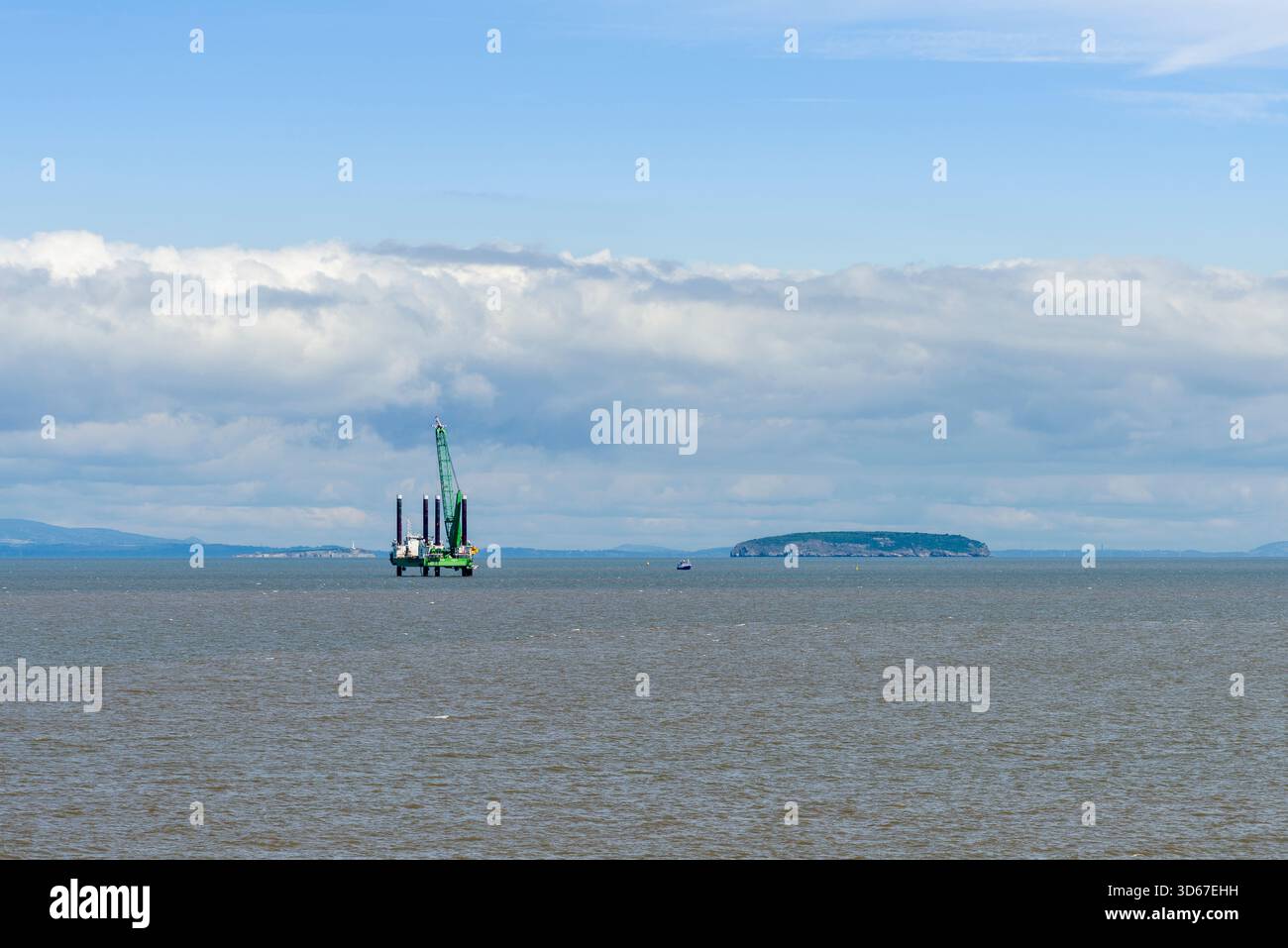 A Neptune jack-up barge in the Bristol Channel installing components ...