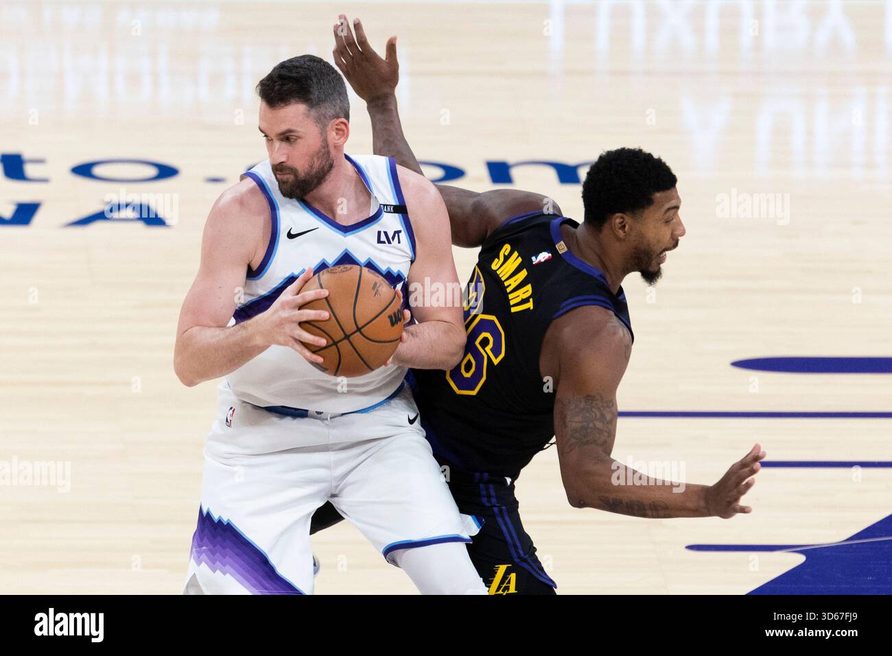 Utah Jazz's Kevin Love (42) and Los Angeles Lakers’ Marcus Smart (36 ...
